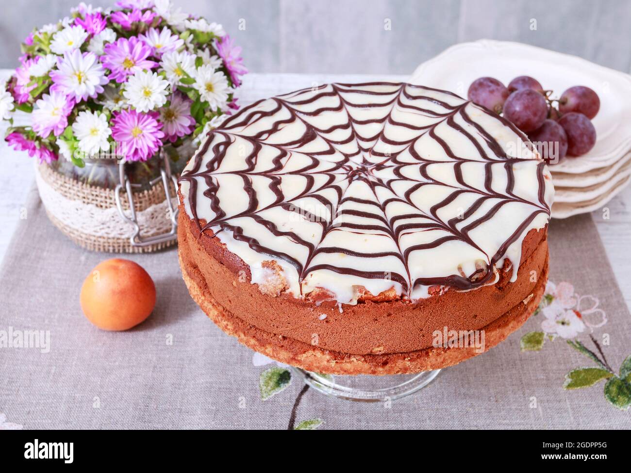 Halloween chocolate spider web cake. Party dessert Stock Photo - Alamy