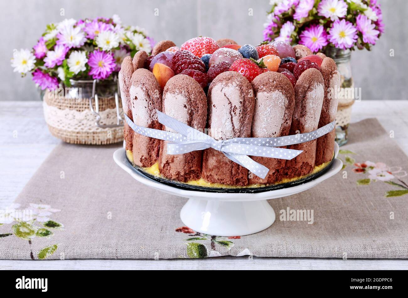 French charlotte cake with summer fruits. Party dessert Stock Photo - Alamy