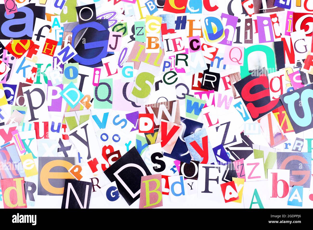 Colorful newspaper letters as background Stock Photo - Alamy