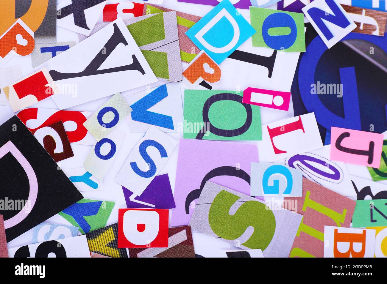 Colorful newspaper letters as background Stock Photo - Alamy