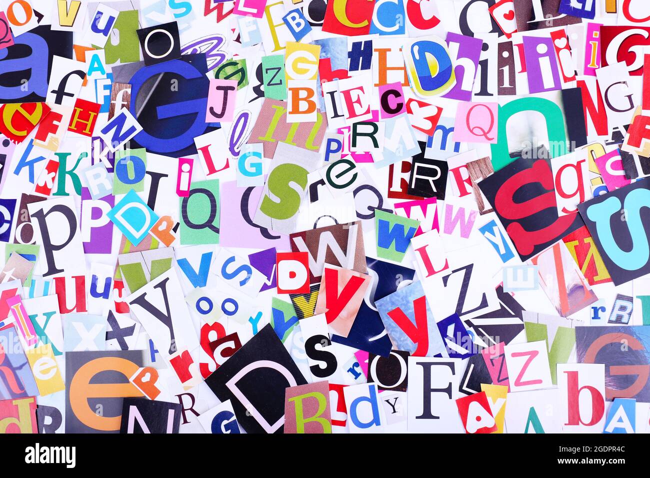 Colorful newspaper letters as background Stock Photo - Alamy