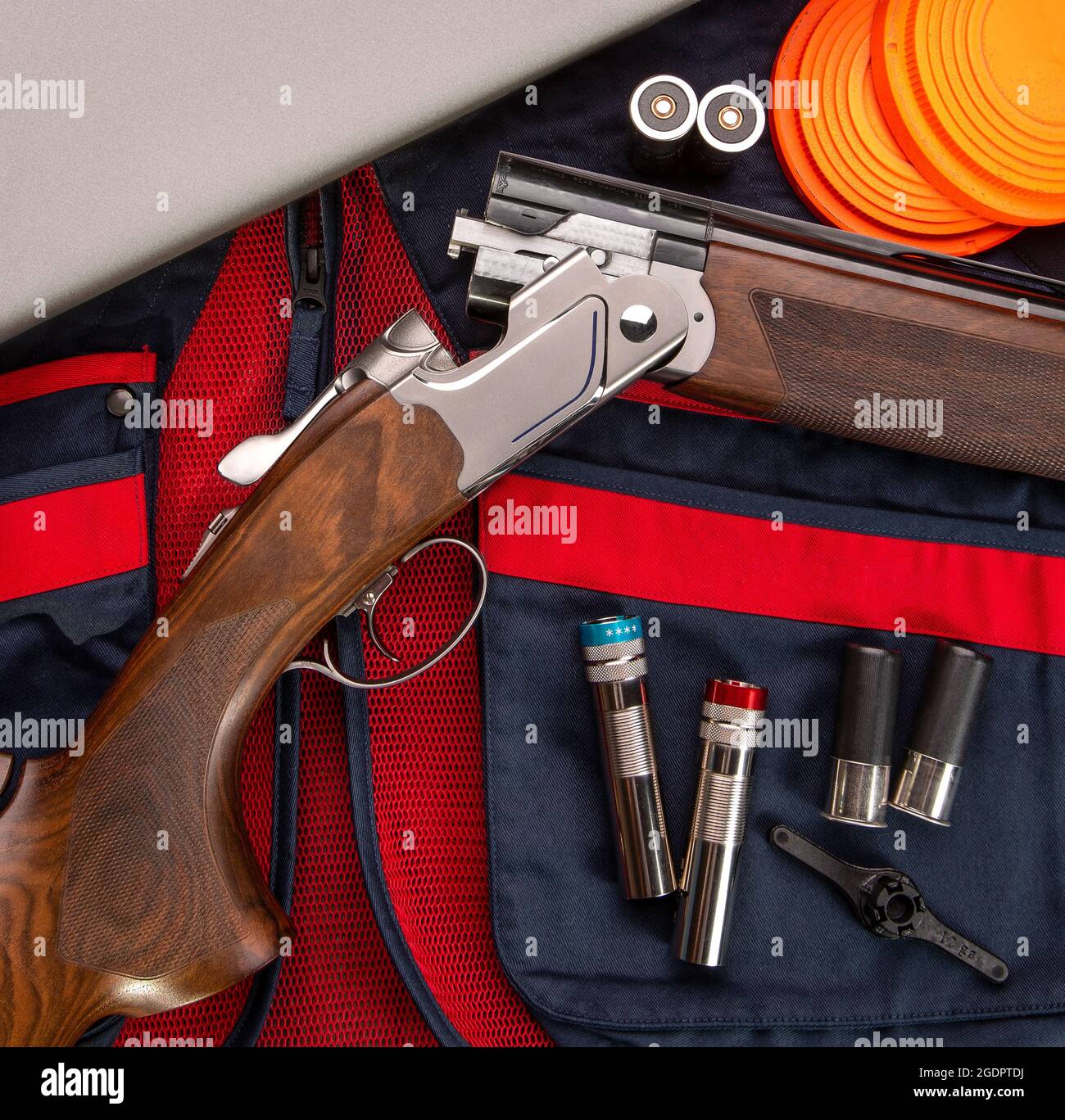 Double-barreled vertical shotgun and cartridges for it on a sports ...