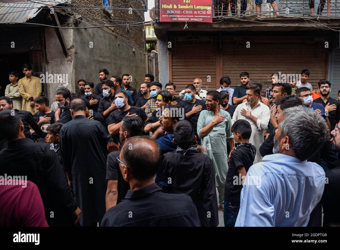 Kashmiri Shia Muslims beat their chests as they mourn during a muharram ...
