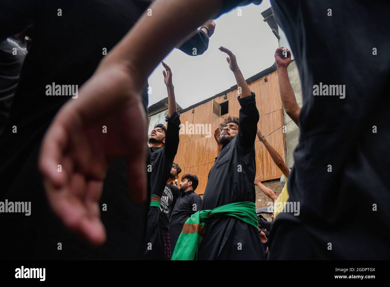 Kashmiri Shia Muslims beat their chests as they mourn during a muharram ...