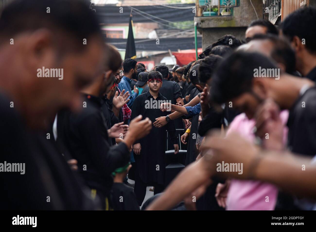 Kashmiri Shia Muslims beat their chests as they mourn during a muharram ...