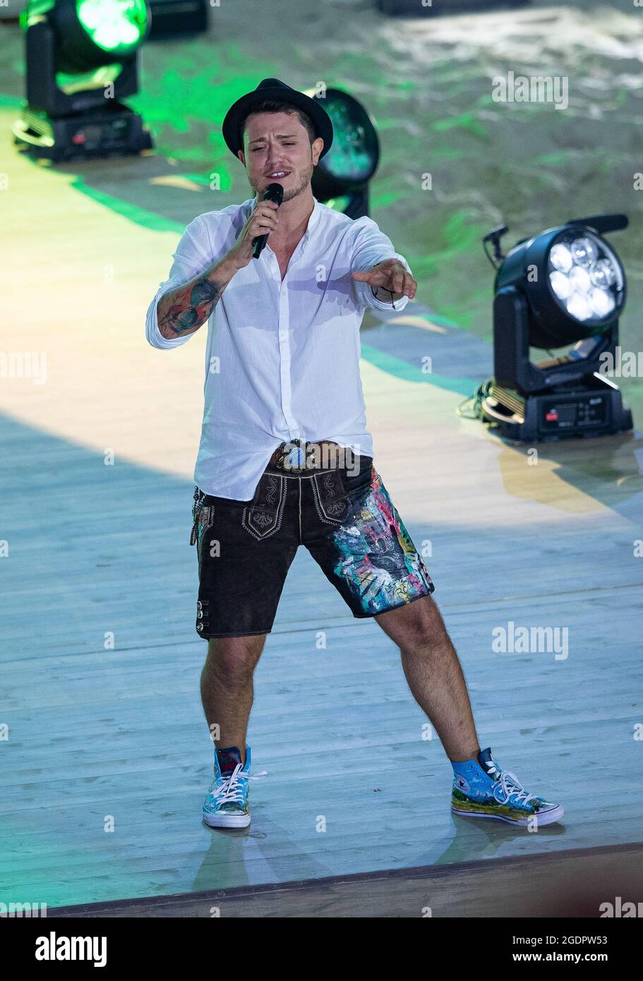 Gelsenkirchen, Germany. 14th Aug, 2021. Singer Max Weidner is on stage ...