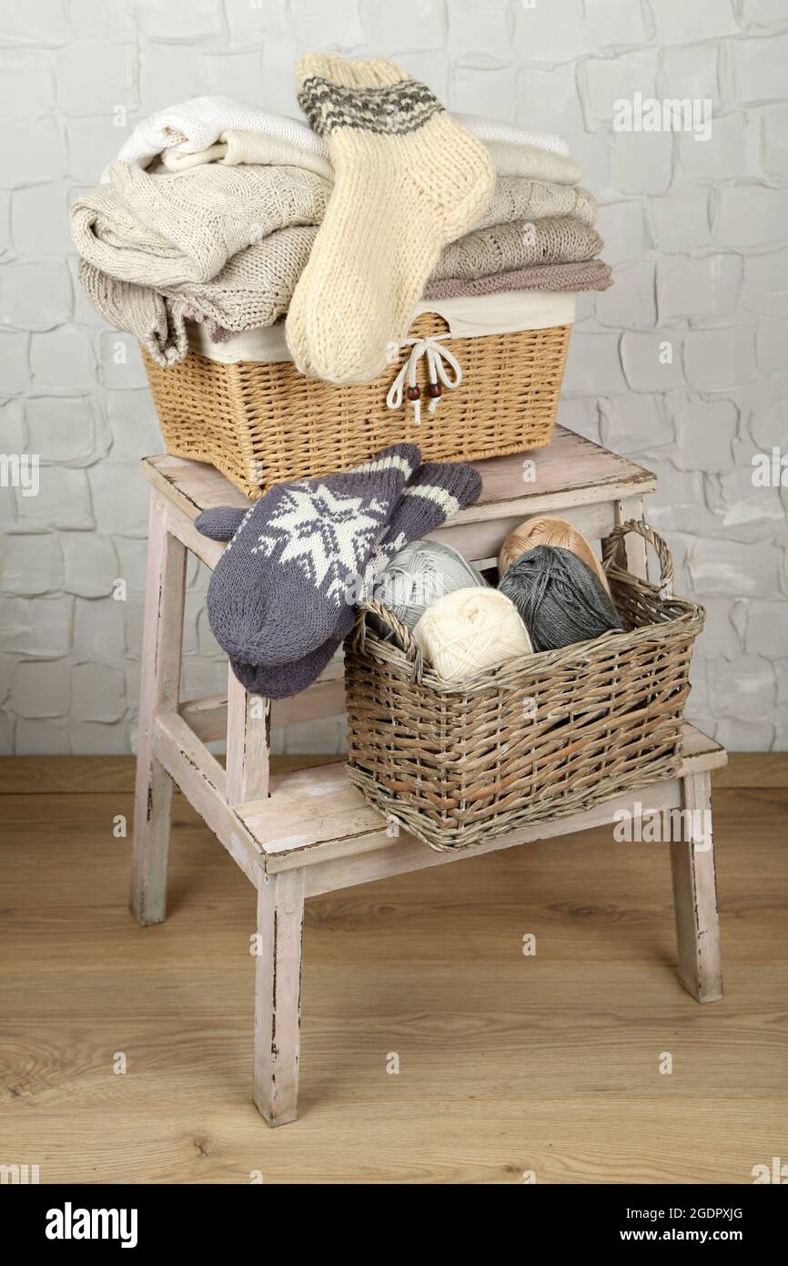 Still life with knitting clothes and yarn on wooden ladder Stock Photo ...