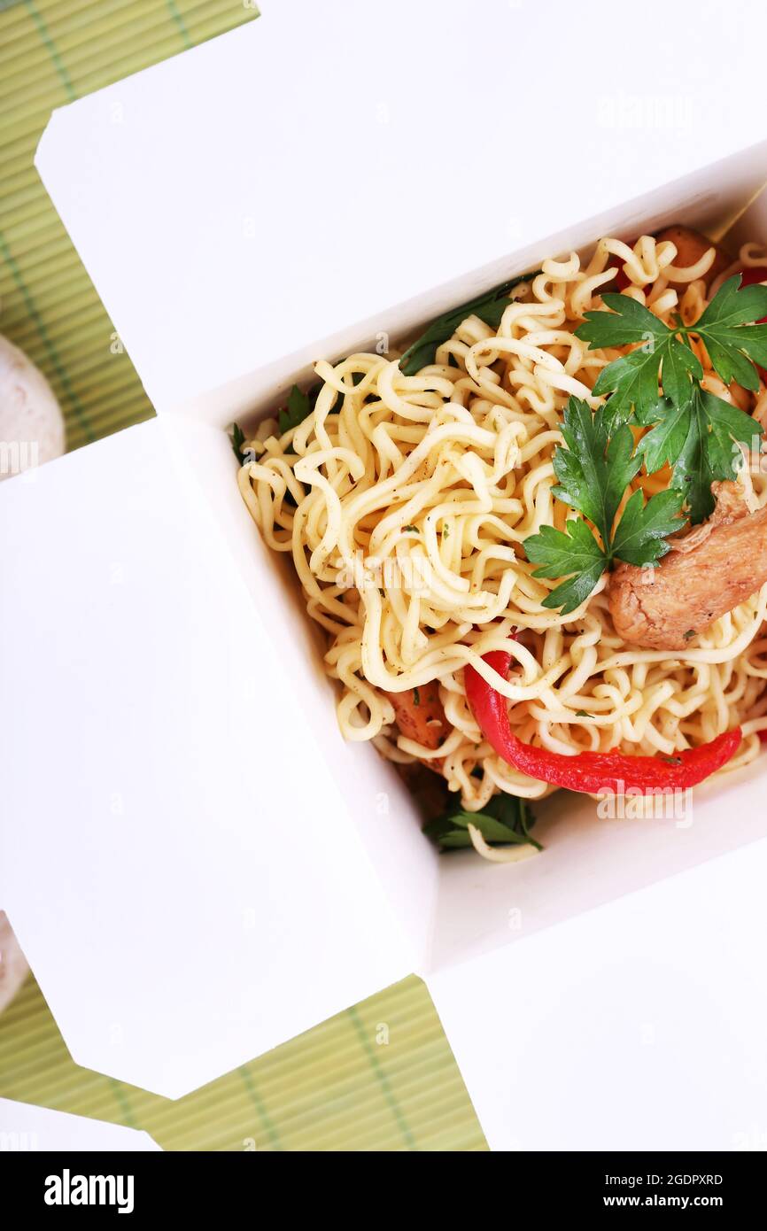 Chinese noodles in takeaway box closeup Stock Photo - Alamy