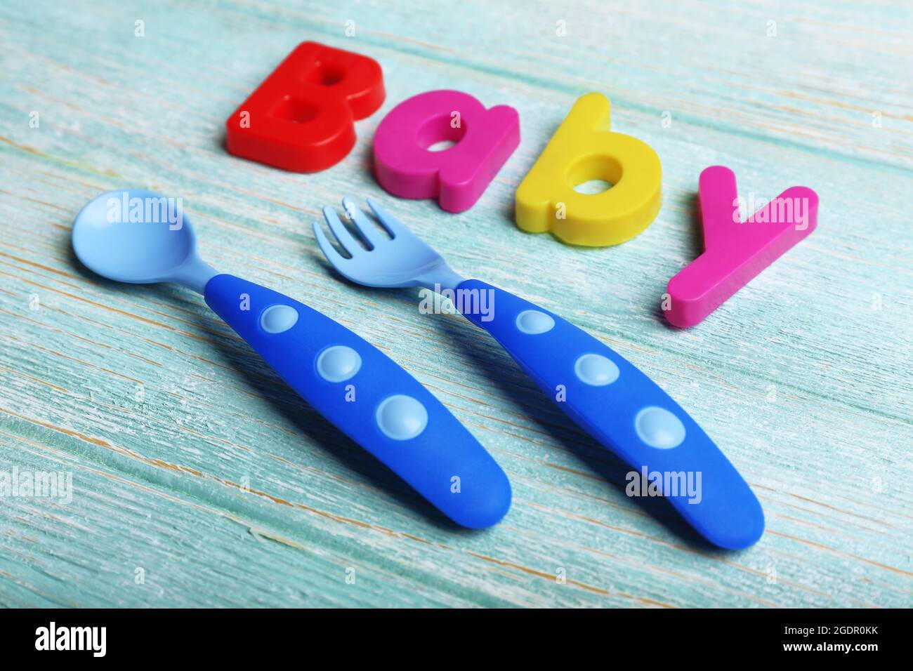 Baby word formed with colorful letters on wooden background Stock Photo ...