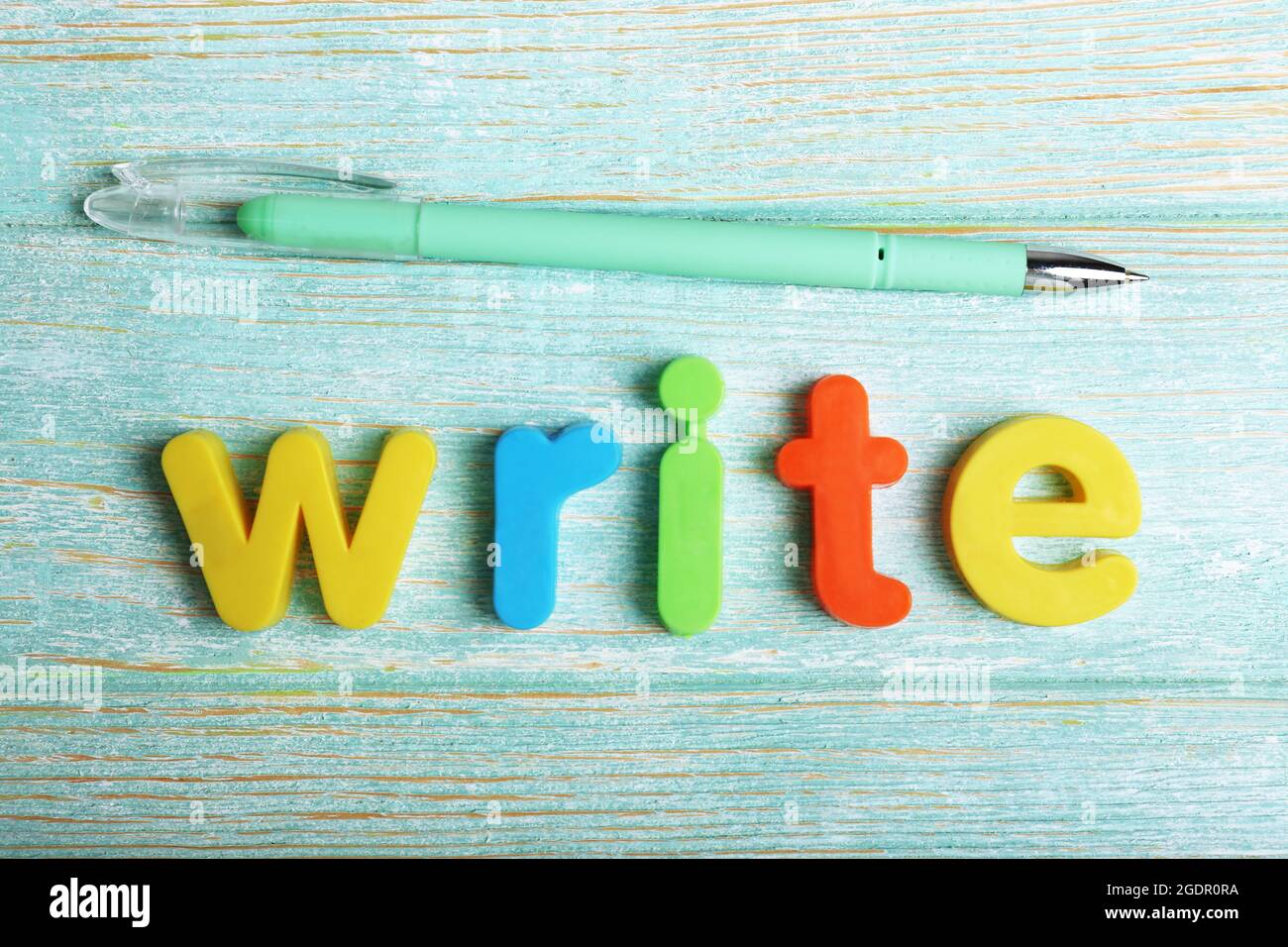 Write word formed with colorful letters on wooden background Stock ...