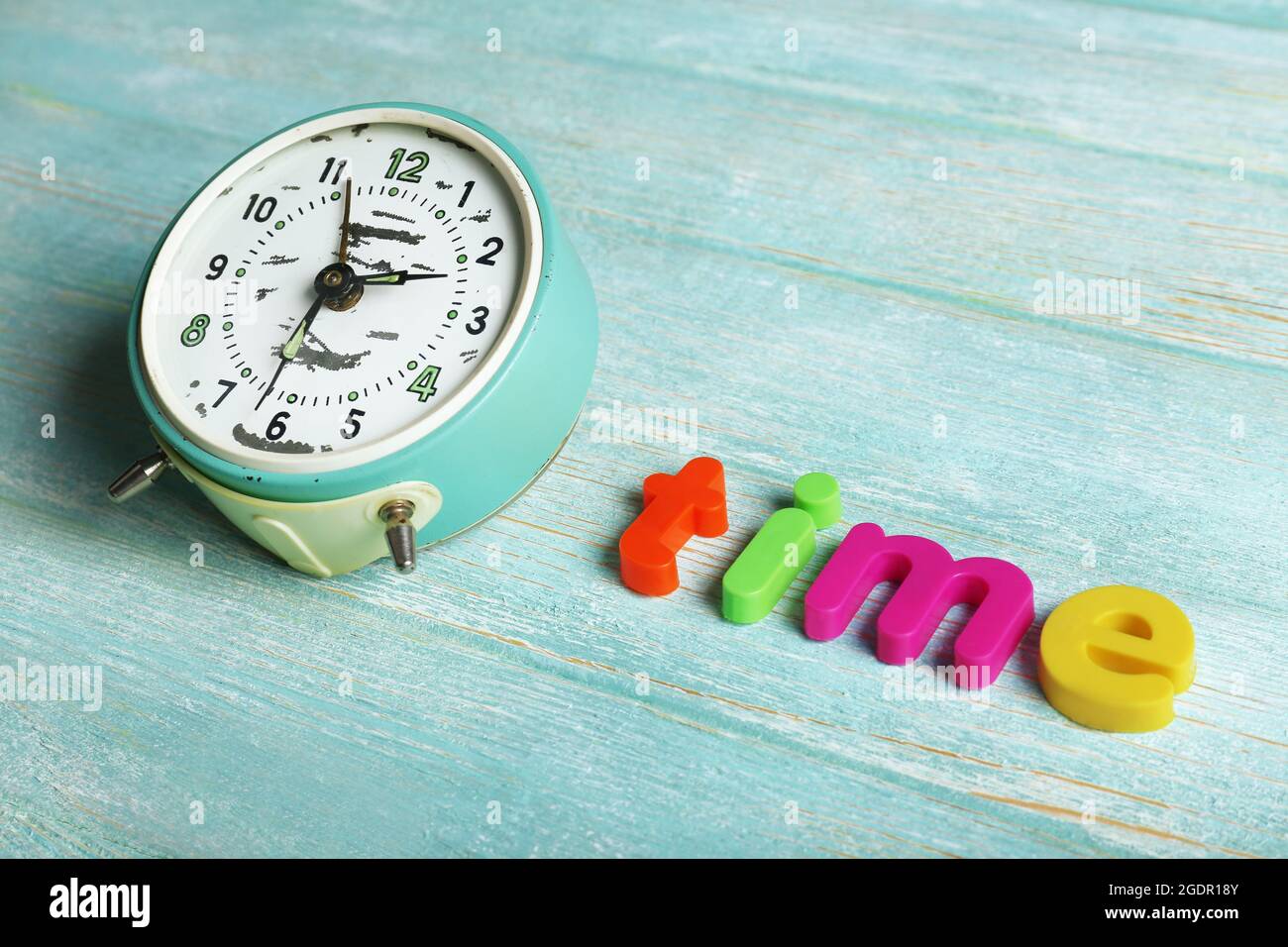 Time word formed with colorful letters on wooden background Stock Photo ...