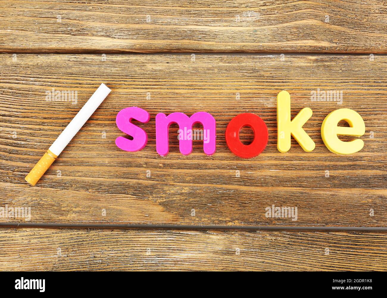 Smoke word formed with colorful letters on wooden background Stock ...