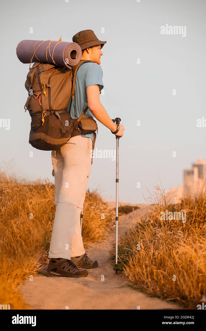 Leisure. A male hiker enjoying view of nature from the hill Stock Photo ...