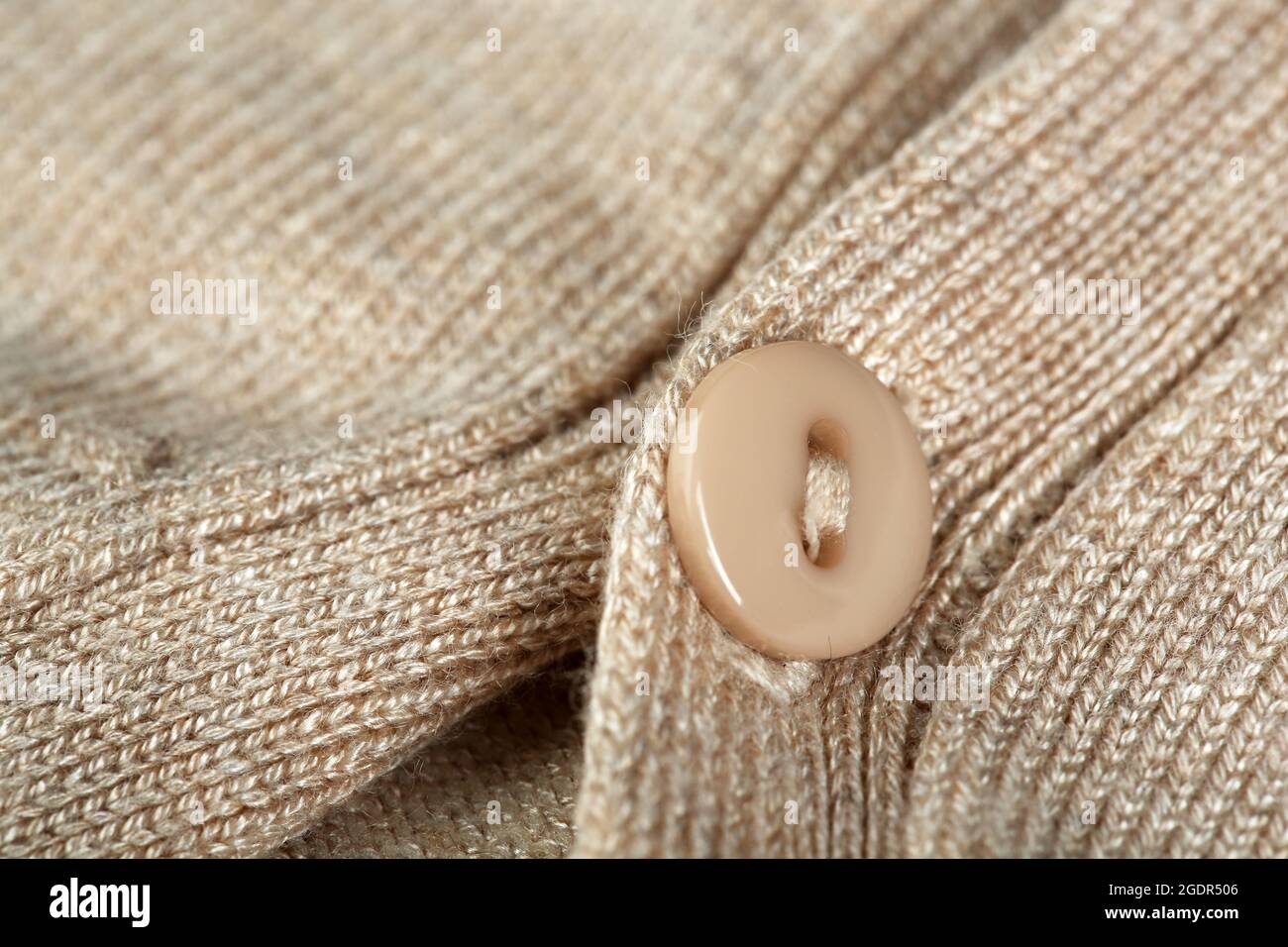 Button on clothes close up Stock Photo - Alamy