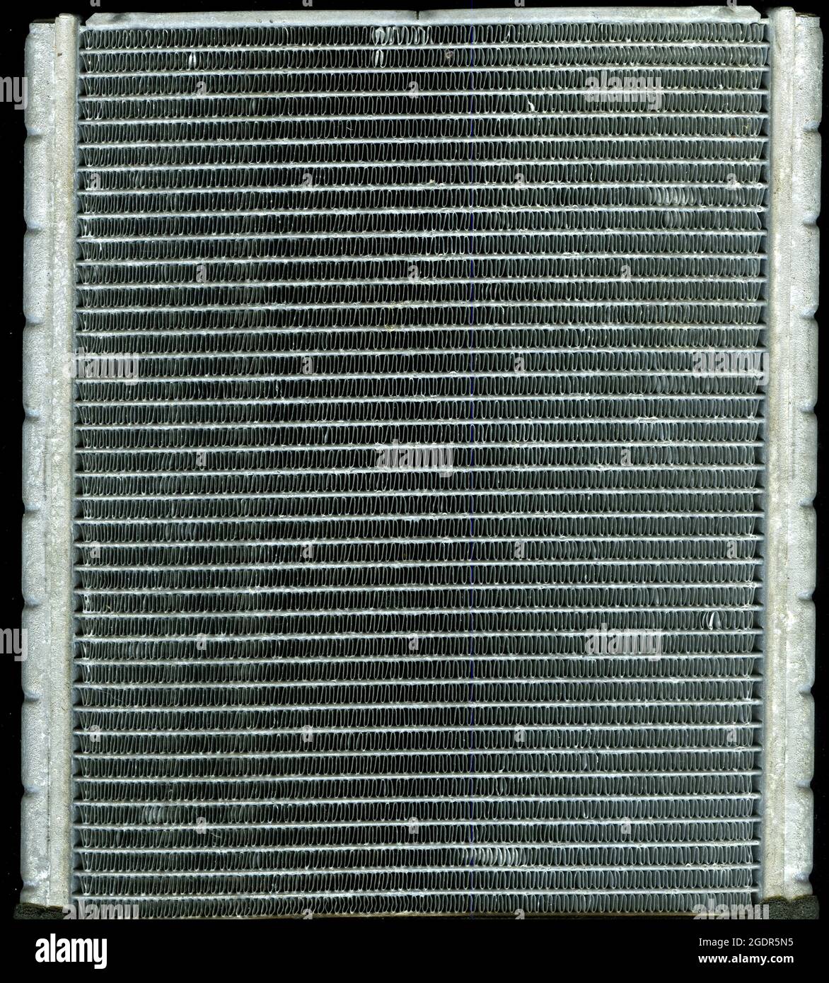 the aluminium ribs on a small cooling unit create an industrial ...