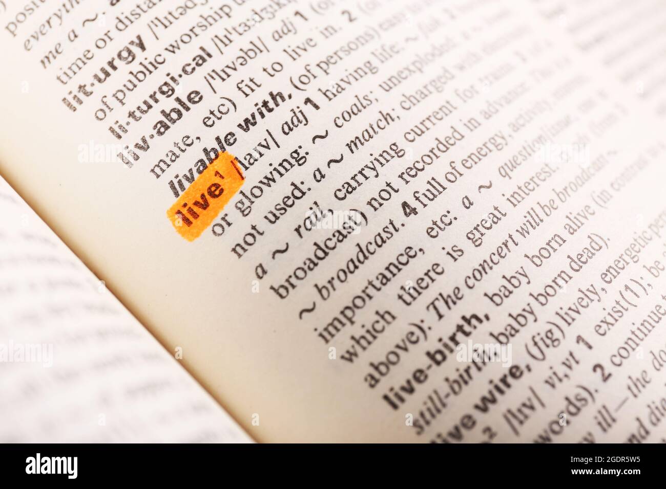 Word highlighted with orange marker Stock Photo - Alamy