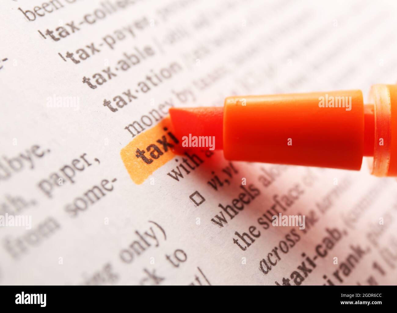 Orange marker highlighting word in dictionary Stock Photo - Alamy