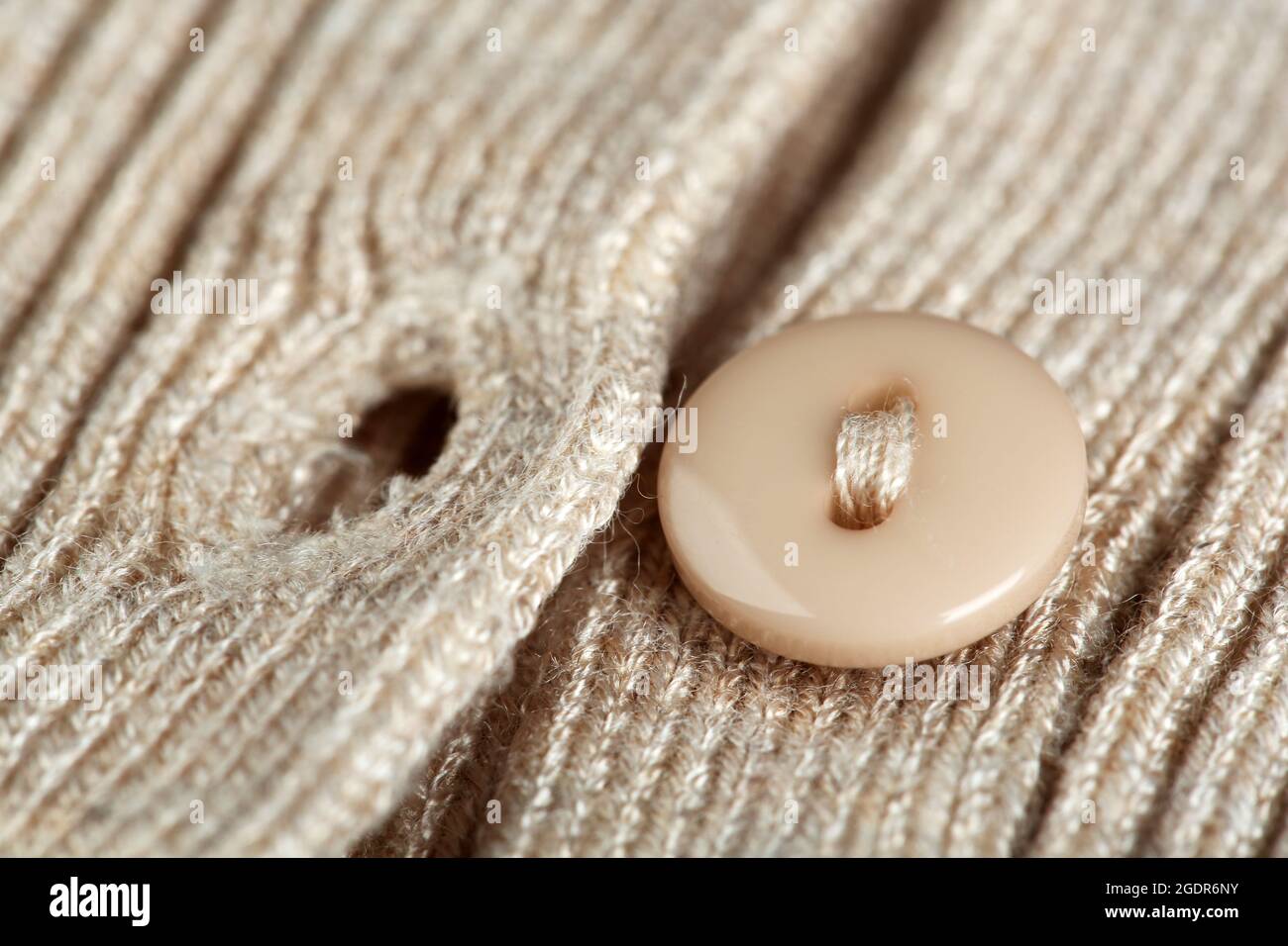Button on clothes close up Stock Photo - Alamy