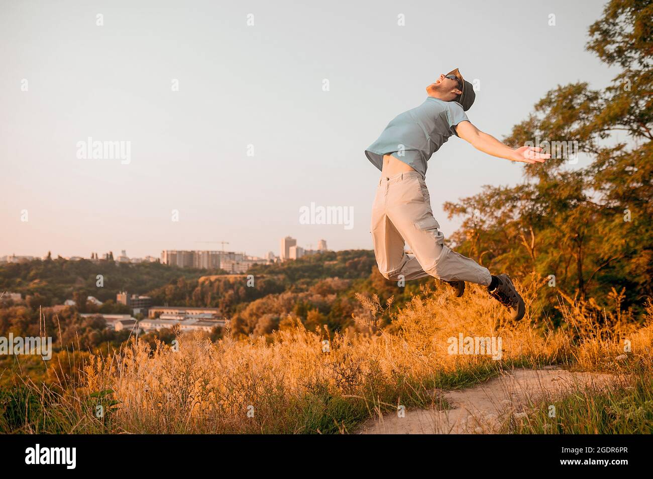 Happy man. A man jumping from excitement and looking happy Stock Photo ...