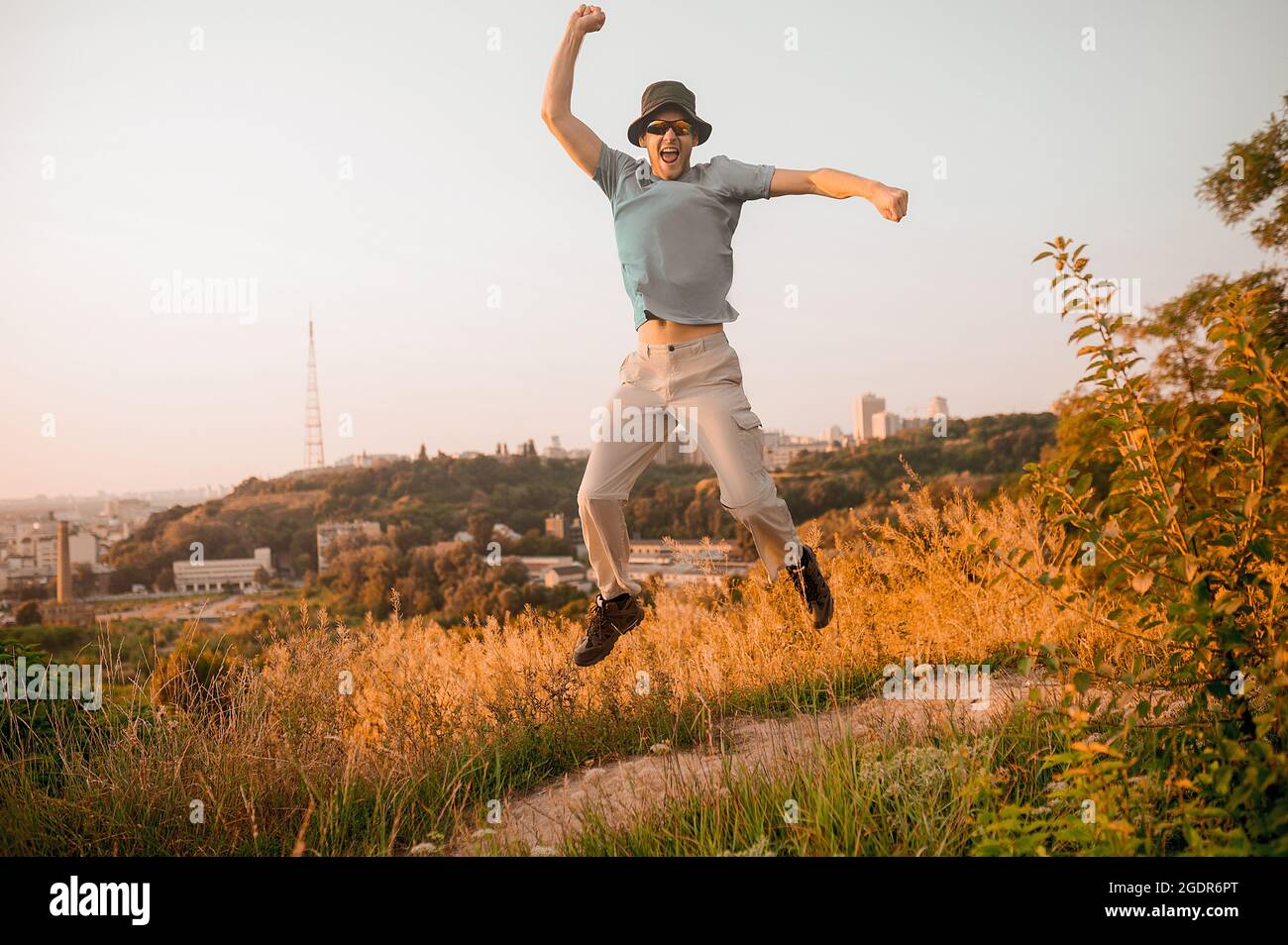 Happy man. A man jumping from excitement and looking happy Stock Photo ...