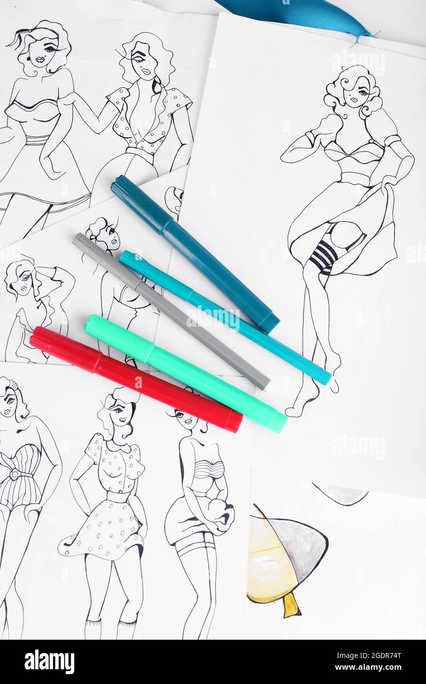 Sketches of clothes on table Stock Photo - Alamy