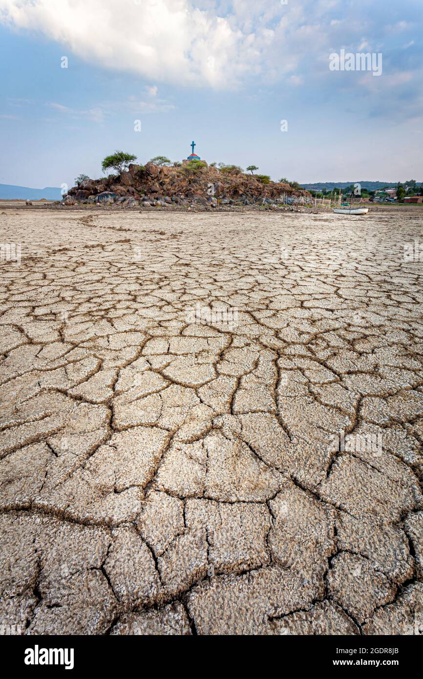 A cross on what is usually a small island on the dry lake bed of Lake ...