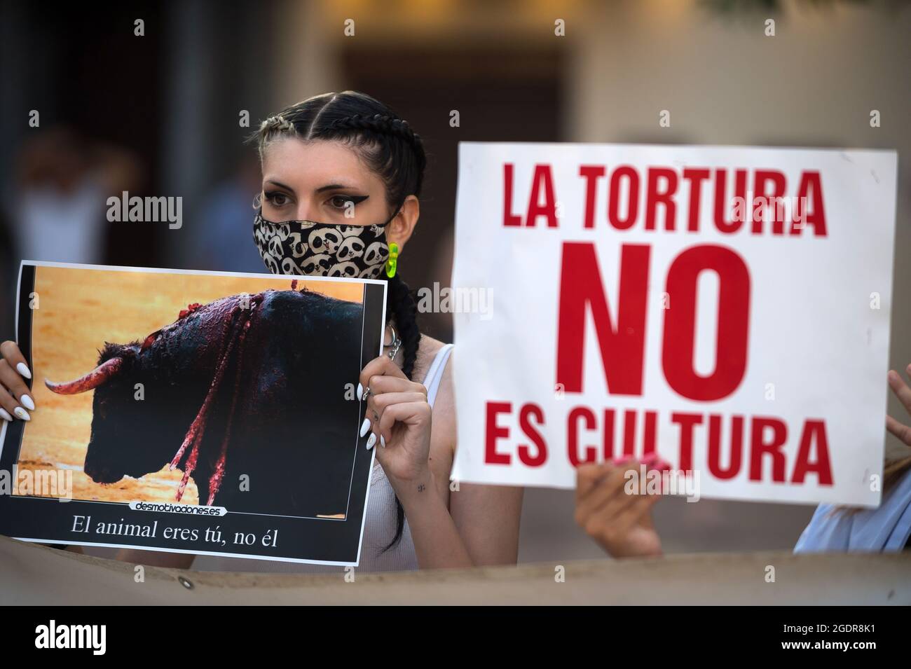 Malaga, Spain. 14th Aug, 2021. A protester holds a placard during the ...
