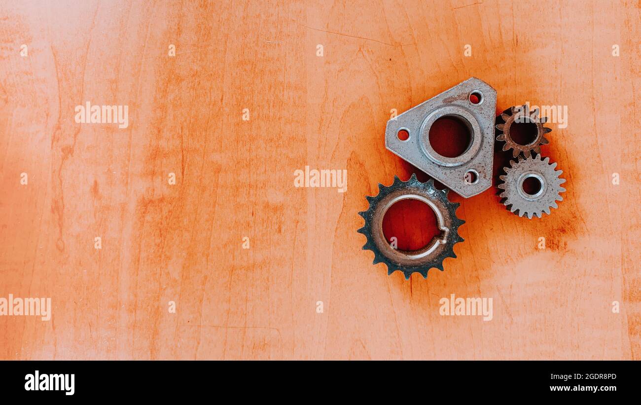 Top view of metal gears on a wooden surface Stock Photo - Alamy