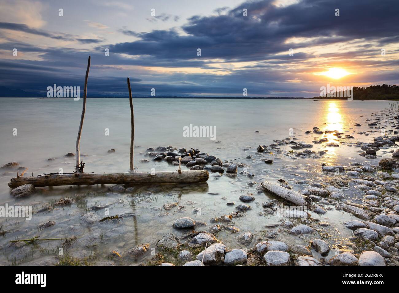 Beautiful shot of a calm sea on sunset sky background Stock Photo - Alamy