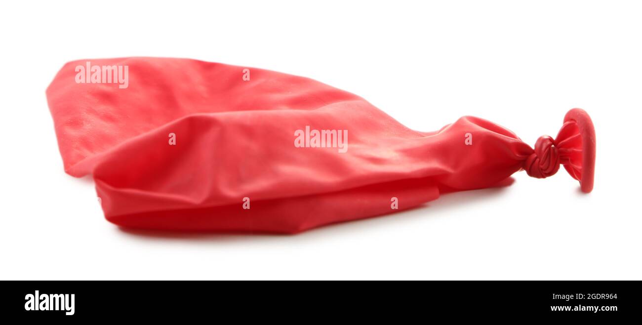 Popped red balloon isolated on white Stock Photo - Alamy