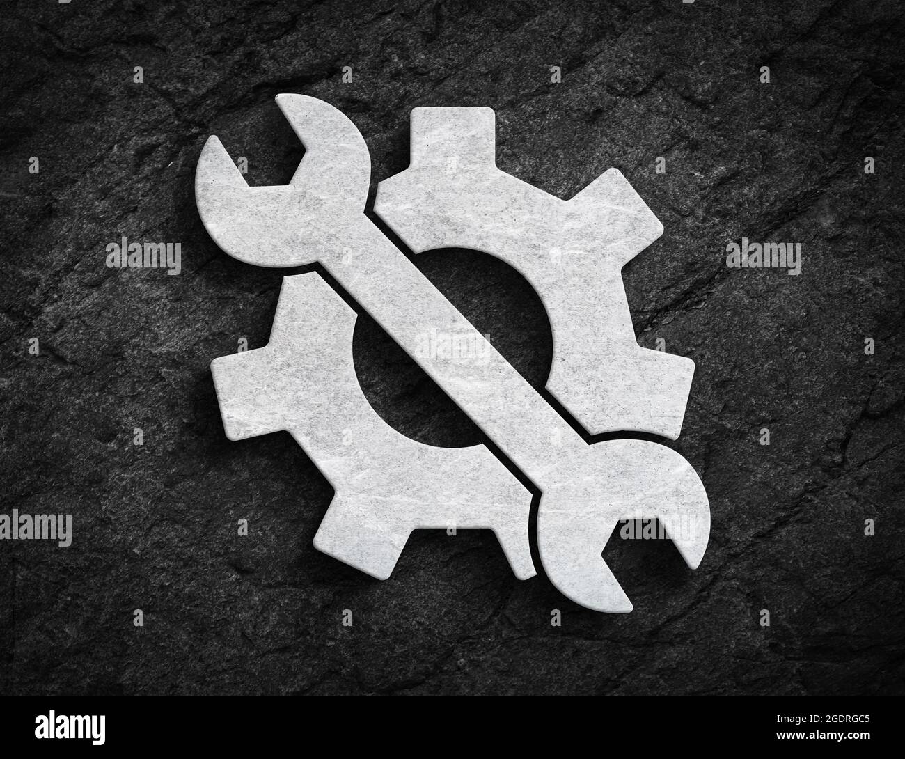 Gear and wrench repair symbol stone wall background Stock Photo - Alamy