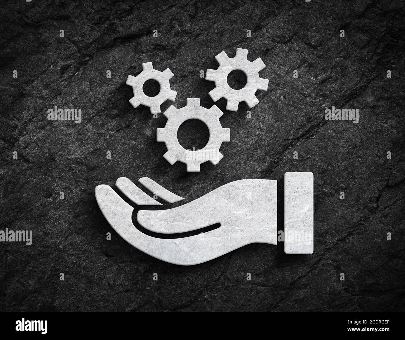 Hand with gears symbol stone wall background Stock Photo - Alamy