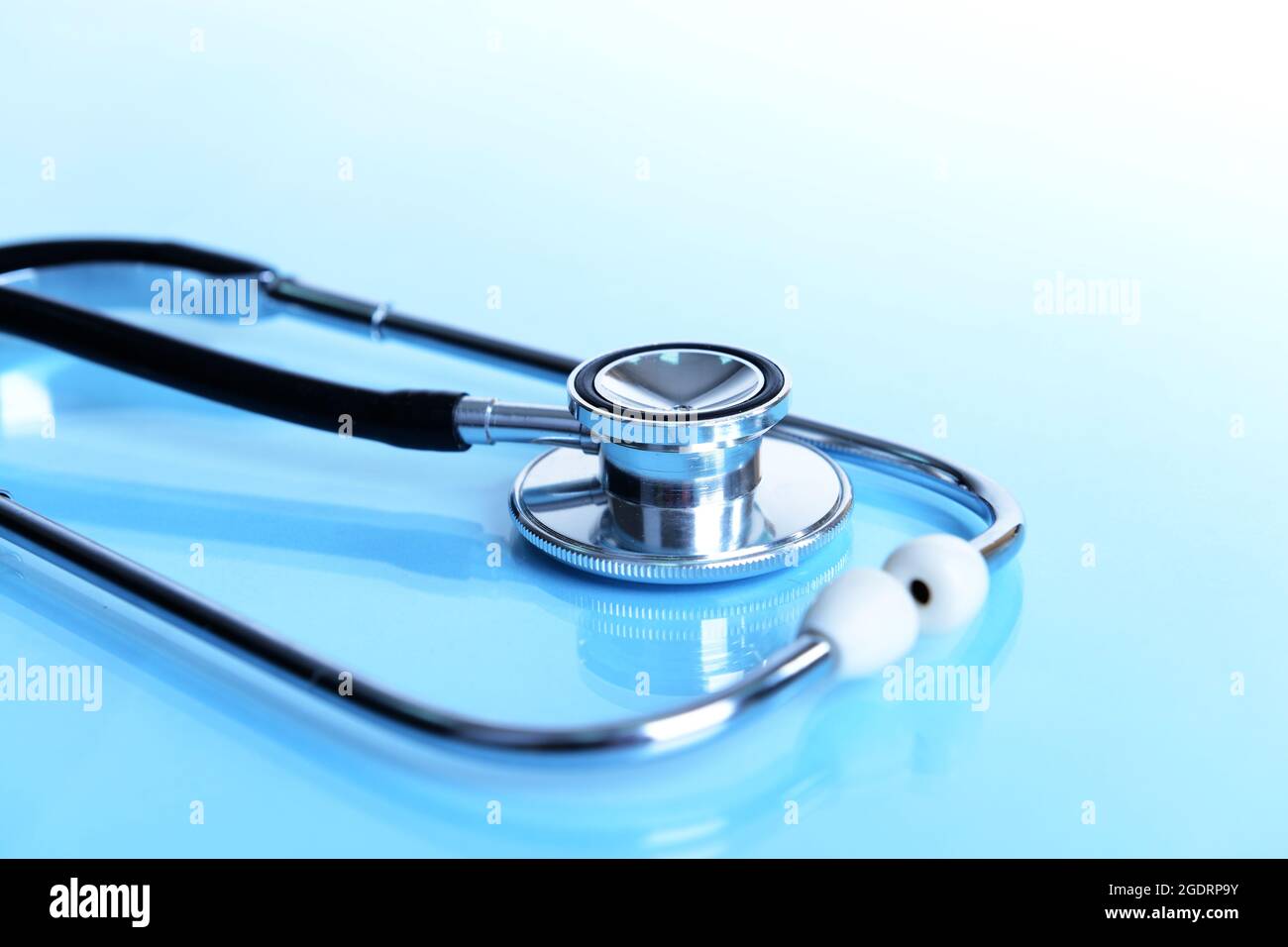Stethoscope on light blue background Stock Photo - Alamy