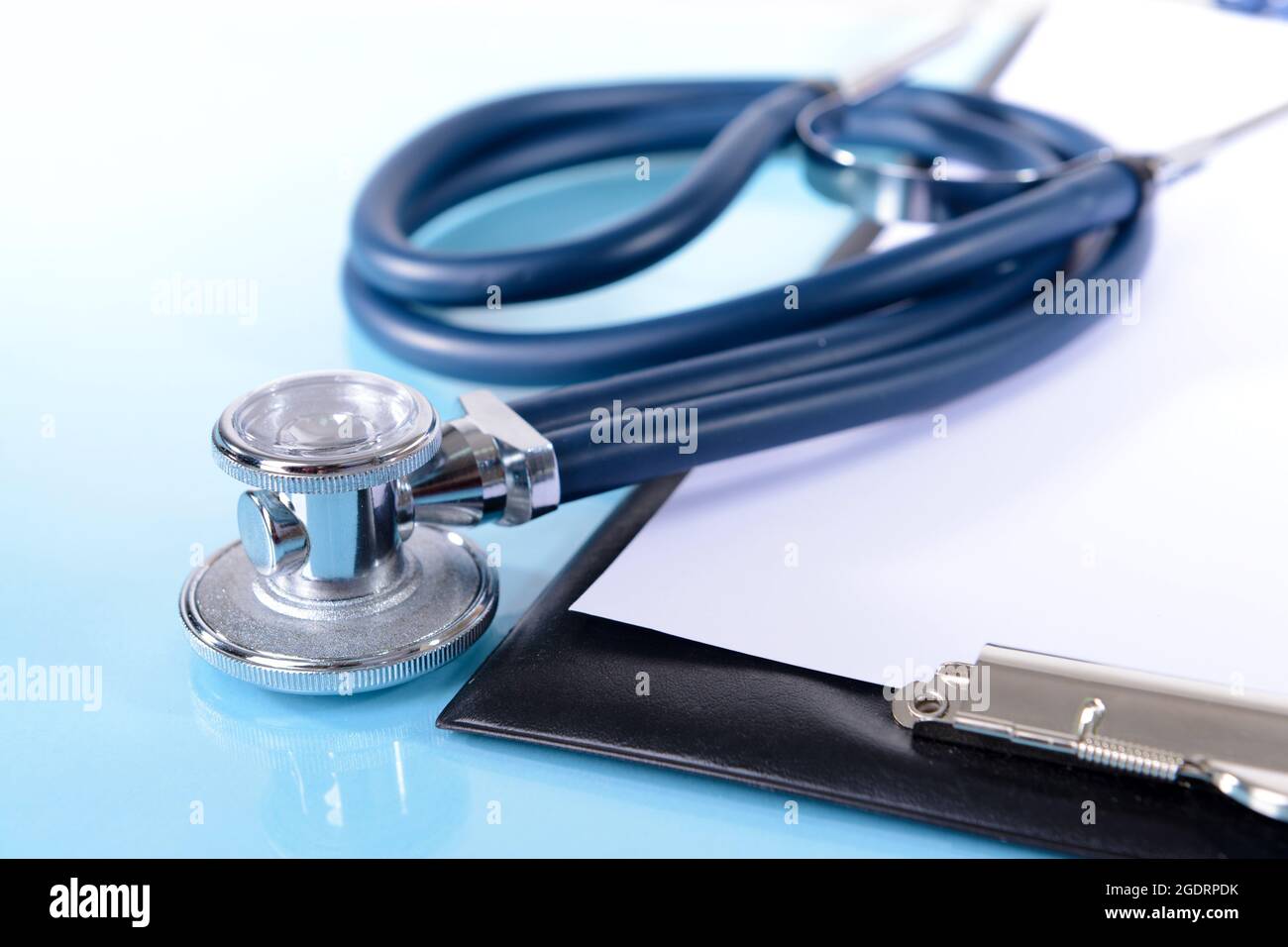 Stethoscope on light blue background Stock Photo - Alamy