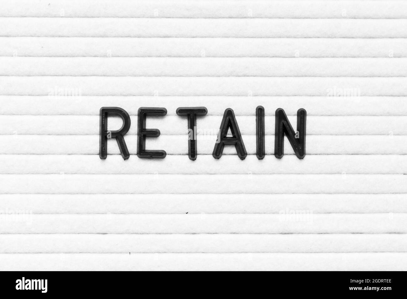Black color letter in word retain on white felt board background Stock ...