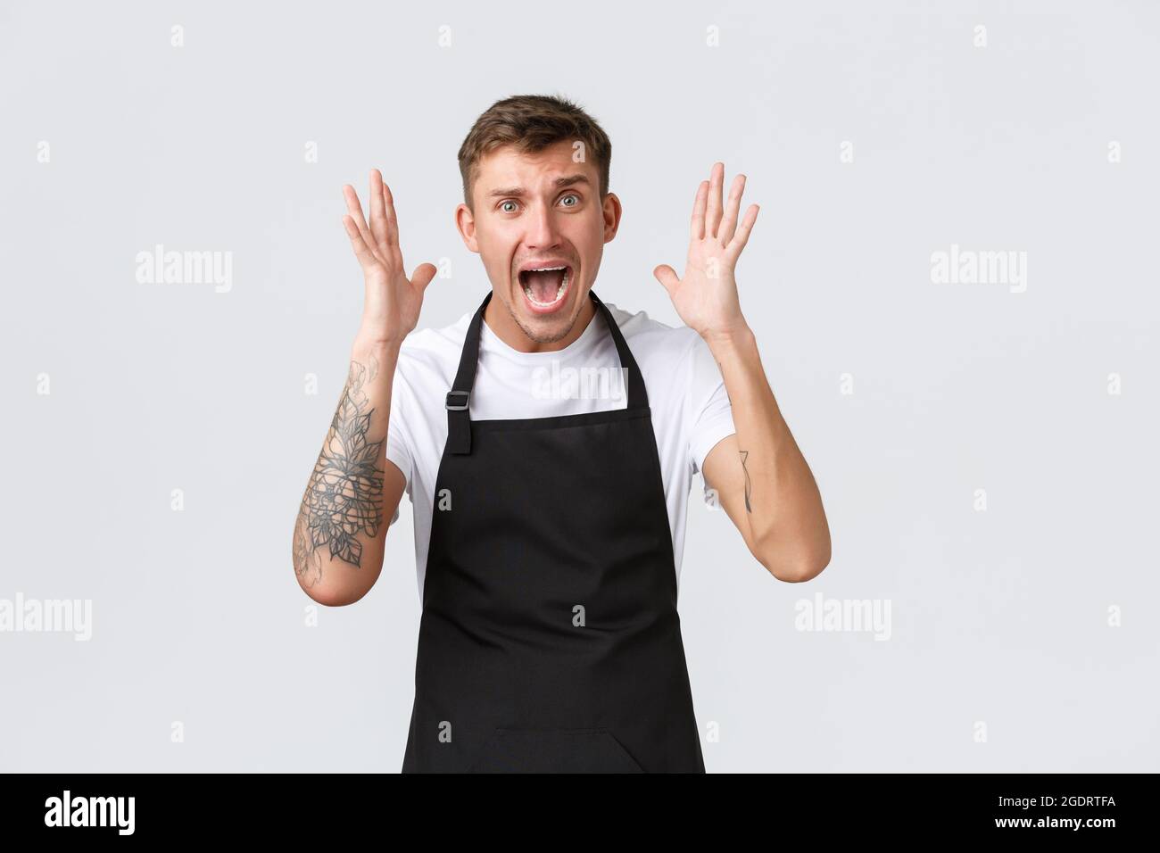 Employees, grocery stores and coffee shop concept. Shocked barista ...