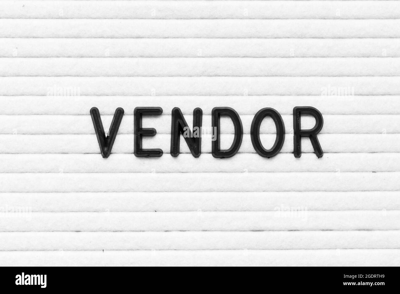 Black color letter in word vendor on white felt board background Stock ...