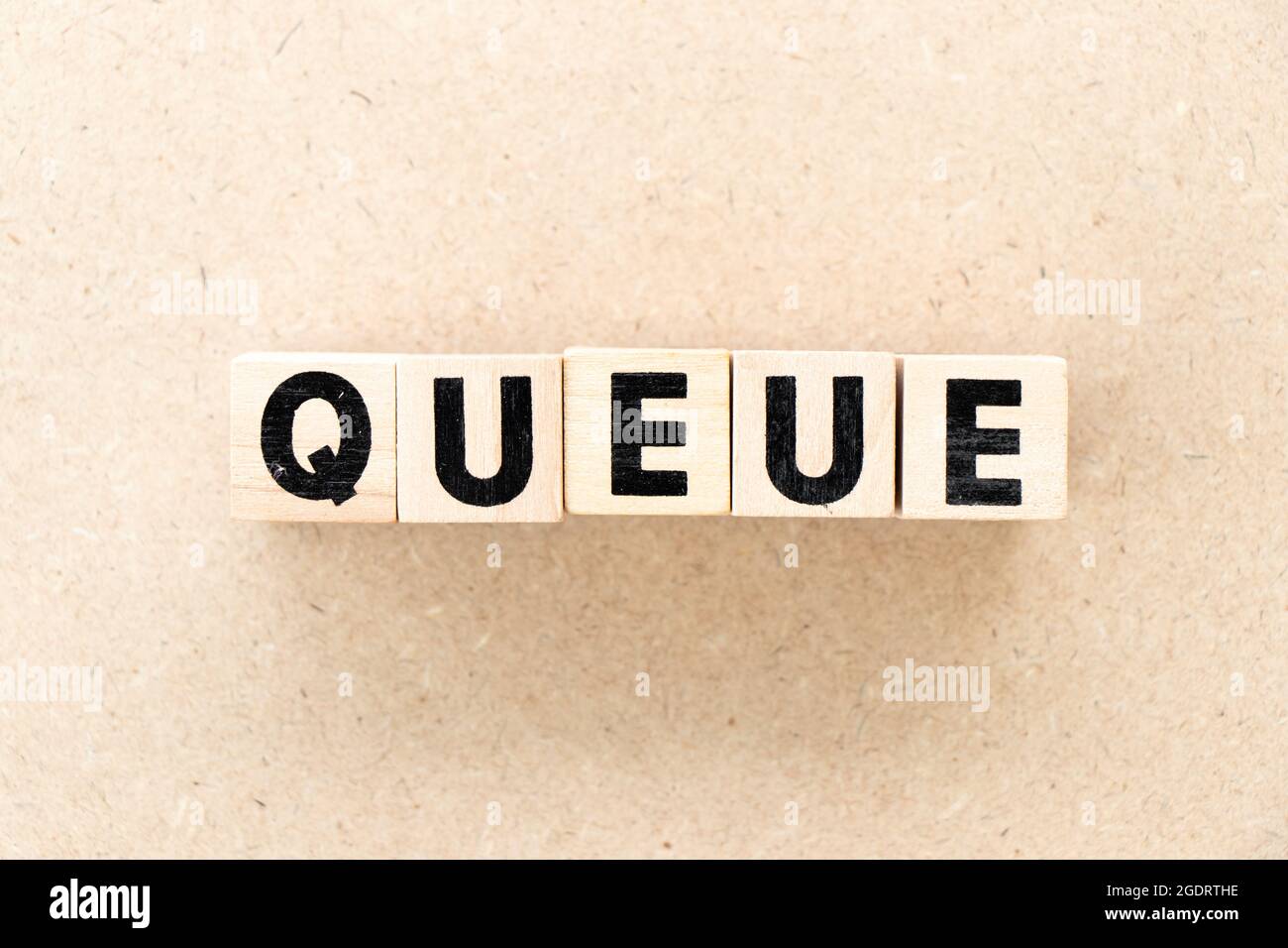 Alphabet letter block in word queue on wood background Stock Photo - Alamy