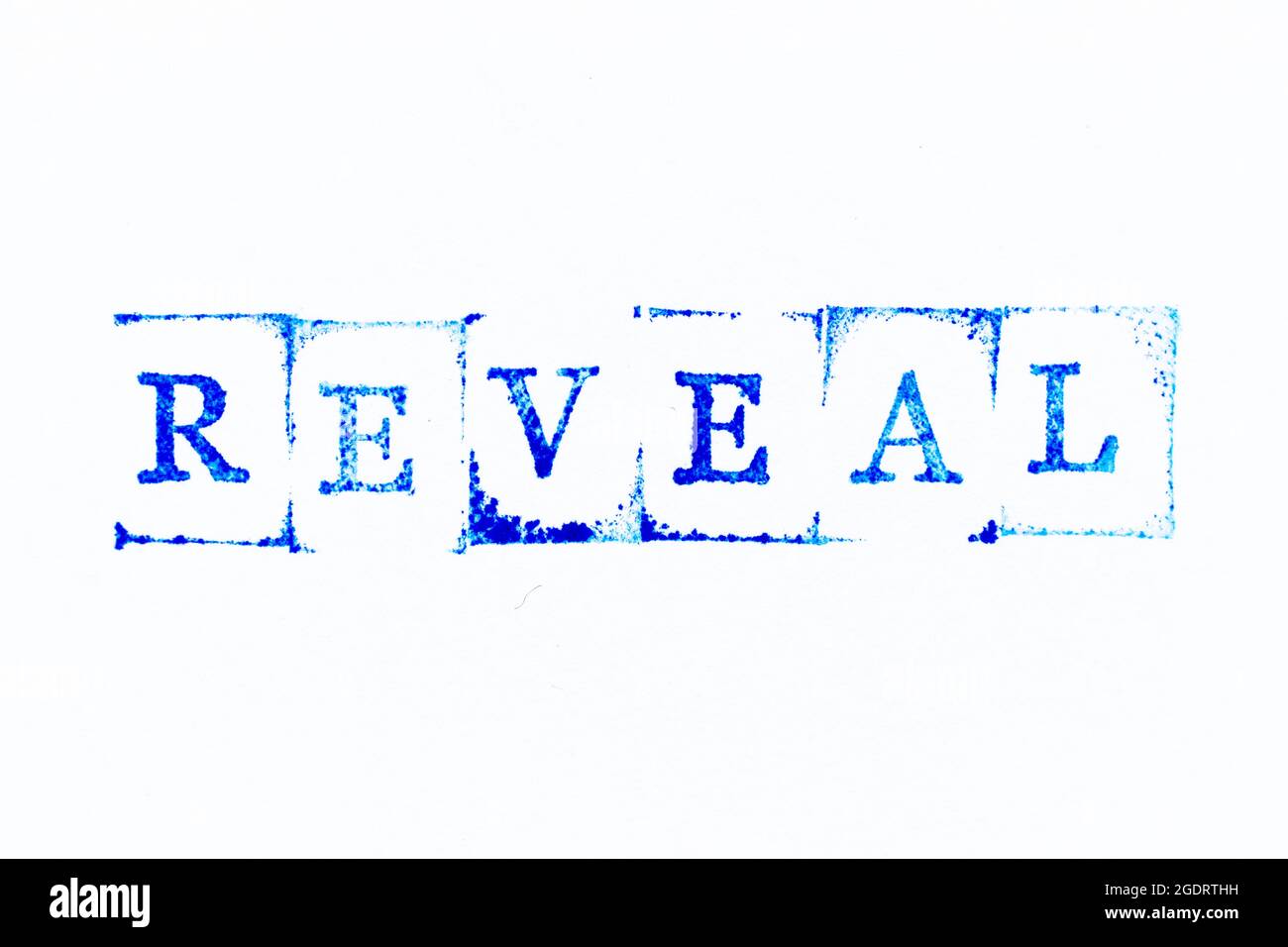 Blue color ink rubber stamp in word reveal on white paper background ...