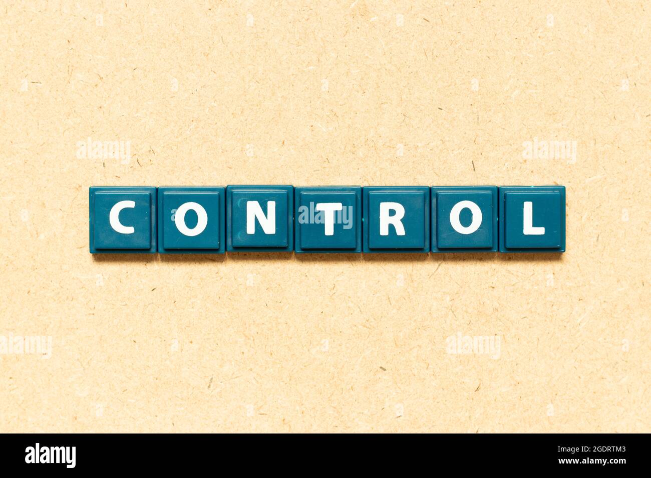 Tile alphabet letter in word control on wood background Stock Photo - Alamy