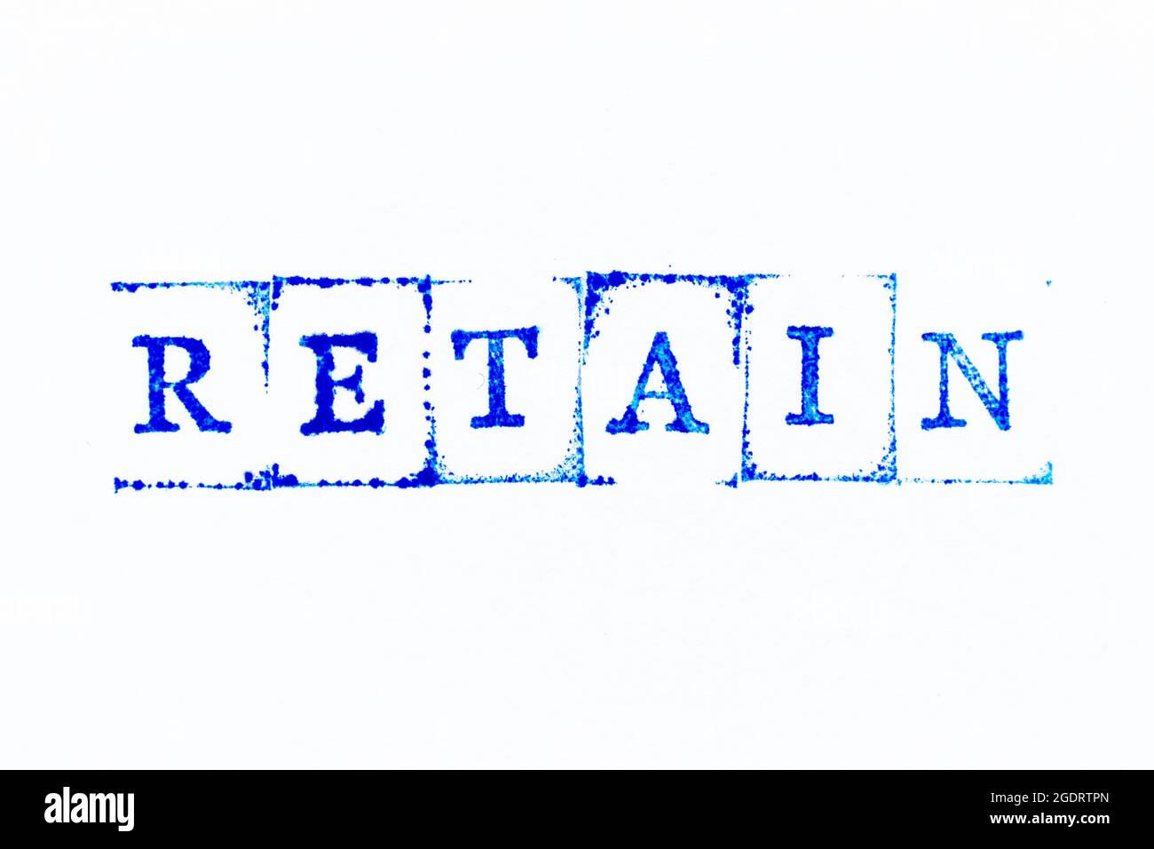 Blue color ink rubber stamp in word retain on white paper background ...