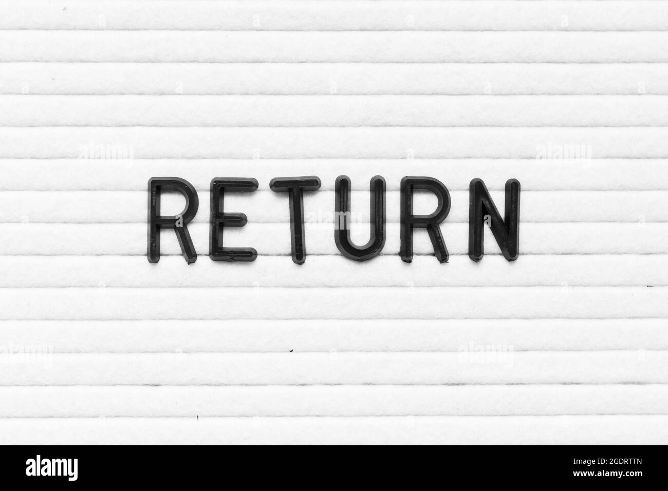 Black color letter in word return on white felt board background Stock ...