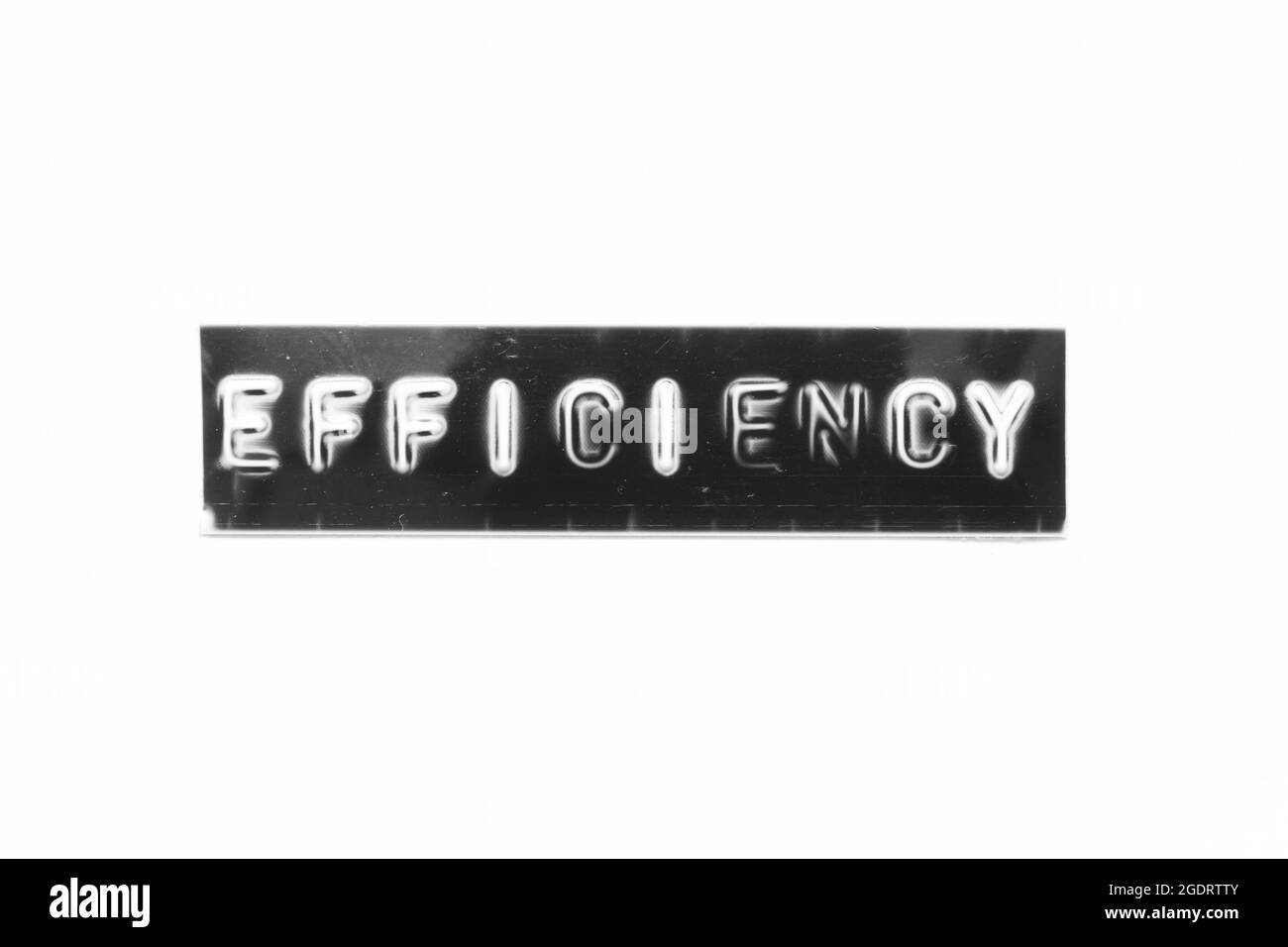 Embossed letter with word efficiency in black banner on white paper ...
