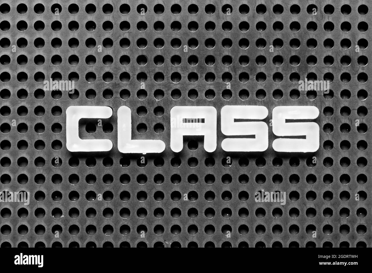 White alphabet letter in word class on black pegboard background Stock ...