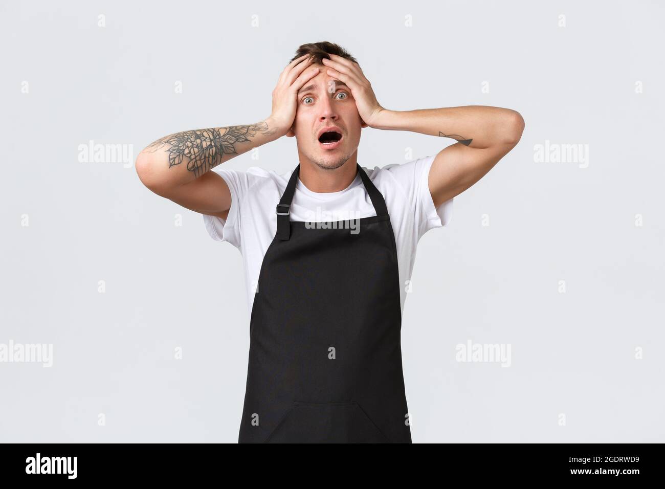 Employees, grocery stores and coffee shop concept. Shocked barista ...