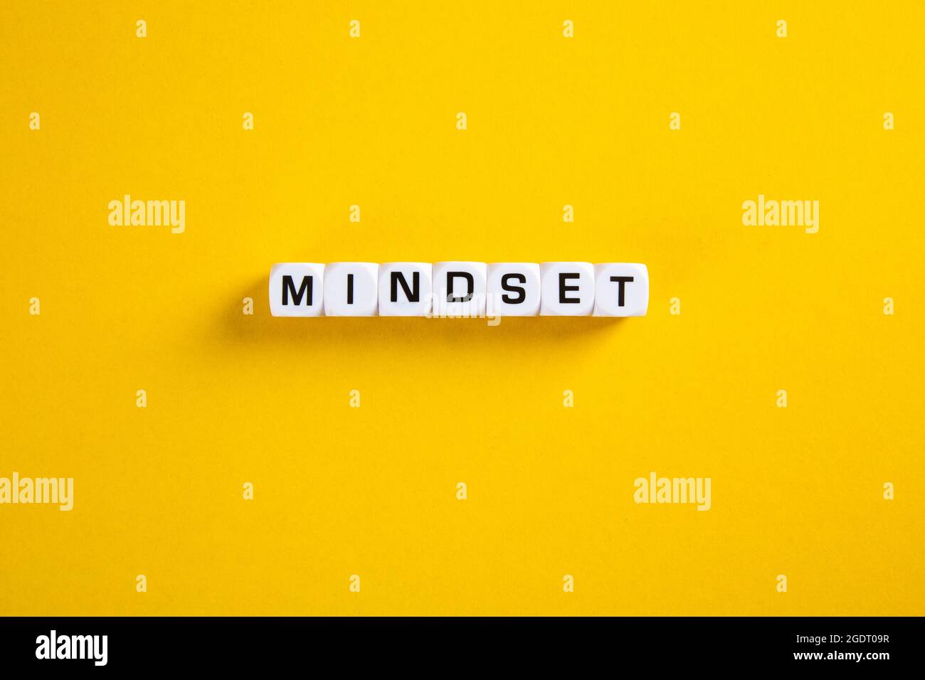 Block with Mindset word on yellow background Stock Photo - Alamy
