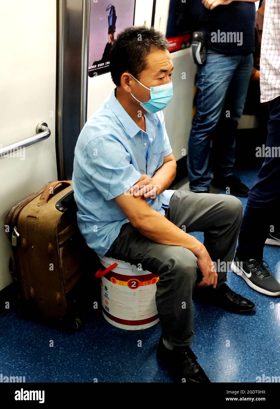 BEIJING, CHINA - AUGUST 13, 2021 - Passengers wearing face masks are ...