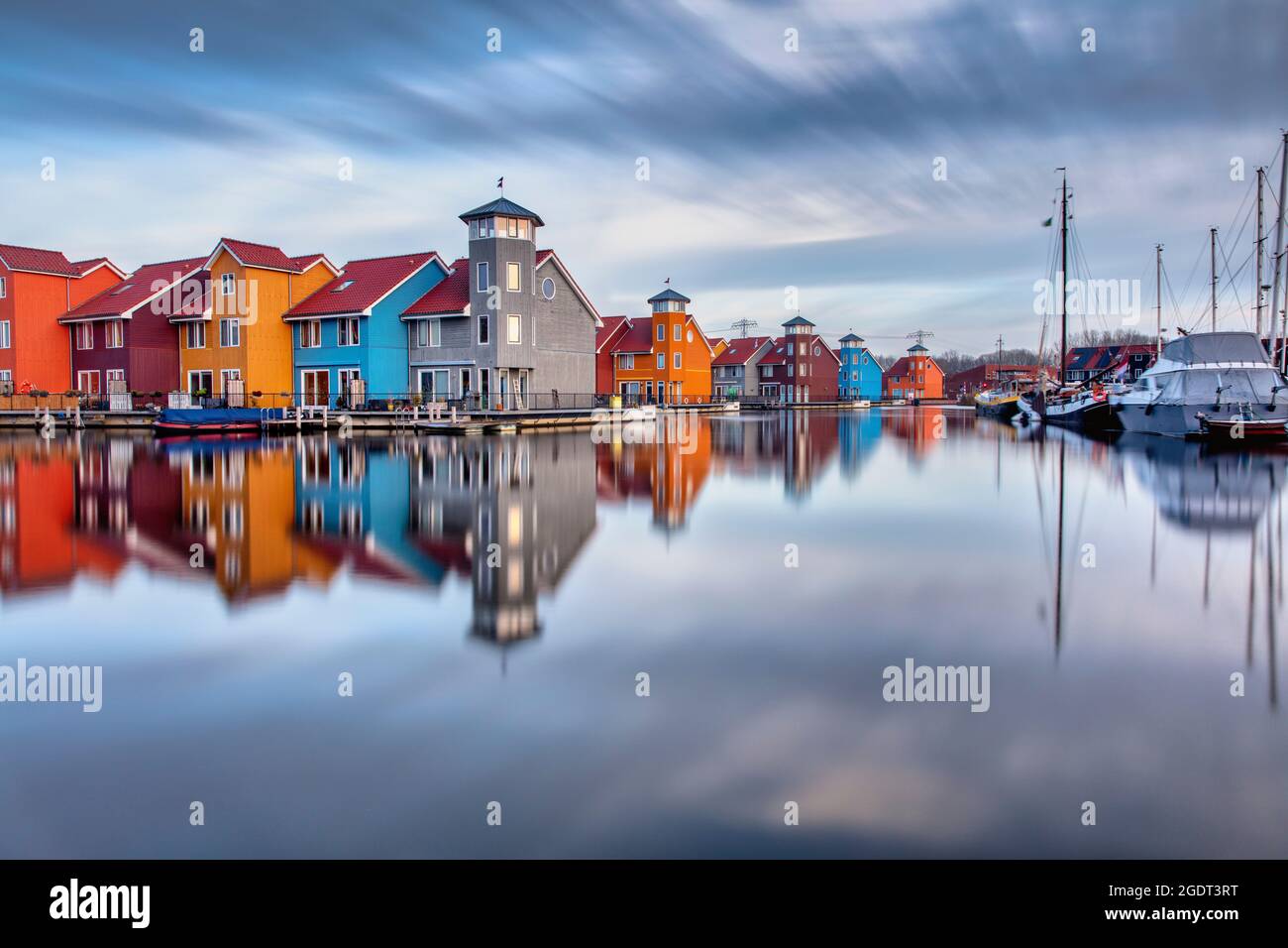 The Netherlands, Groningen, Colourful residential houses and marina ...