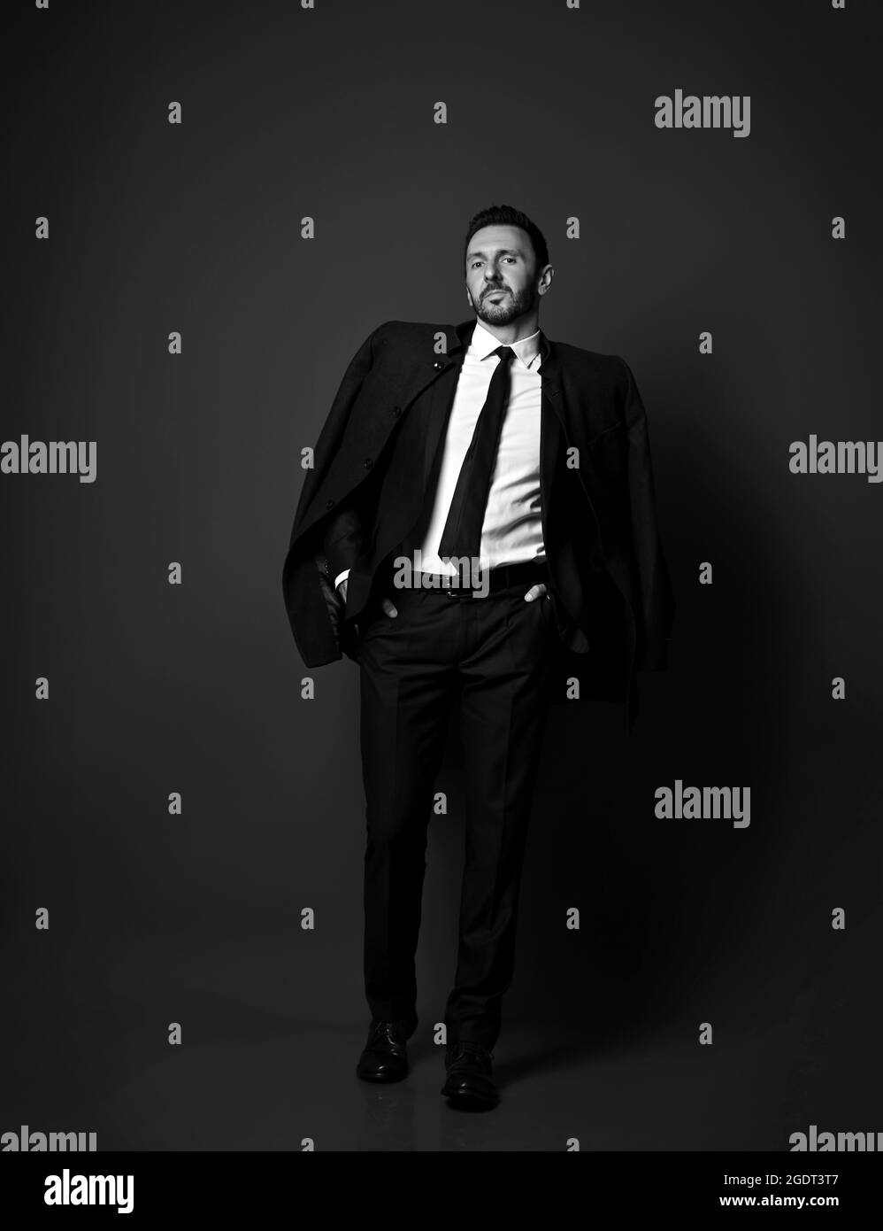 Black and white. Elegant businessman, boss in modern office suit ...