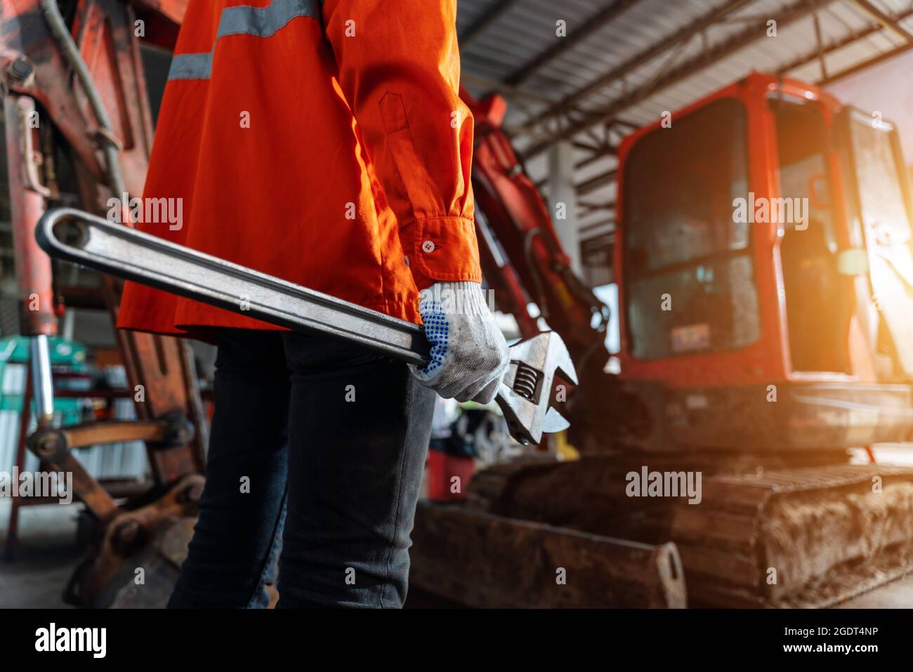 Close up of a human hand holding a tool for maintenance or excavator at ...